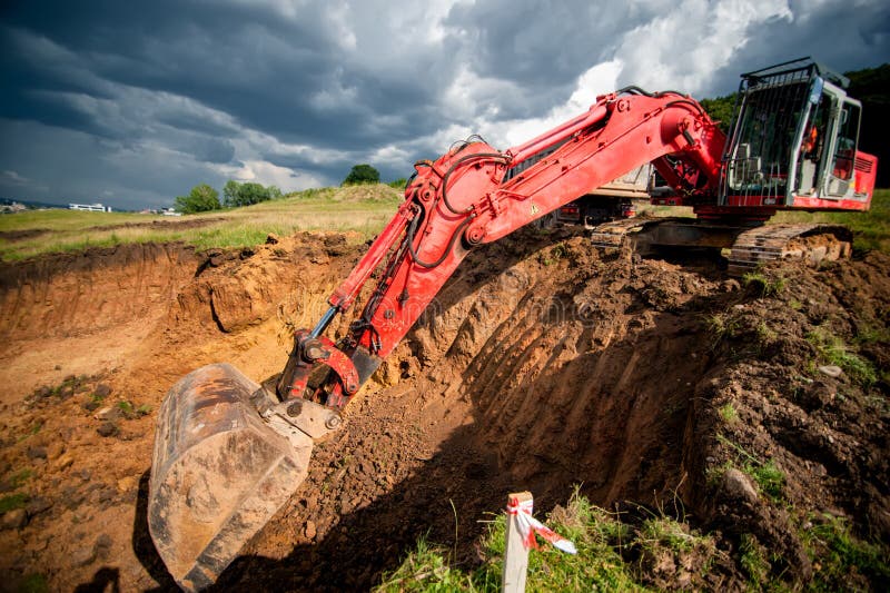 Industrial Excavator Loading Soil from Highway Construction Site Stock ...