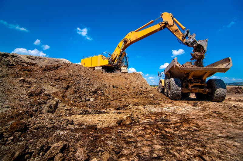 Industrial Excavator Loading Soil Material Stock Photo - Image of dump ...
