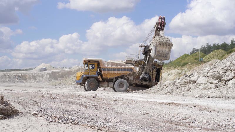 Industrial Extraction of Chalk. the Excavator Loads Chalk into the Dump ...