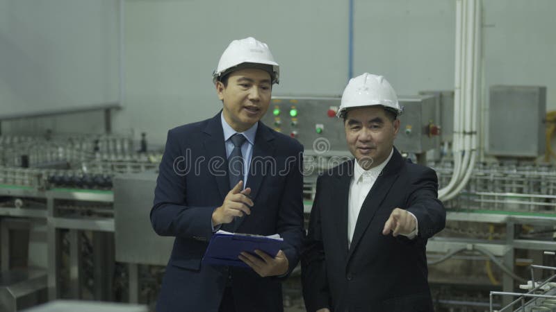 Industrial Facility Managers Overseeing Operations in Food Processing ...