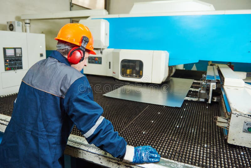 Industrial Factory Worker Operates Punching Machine Stock Photo - Image ...