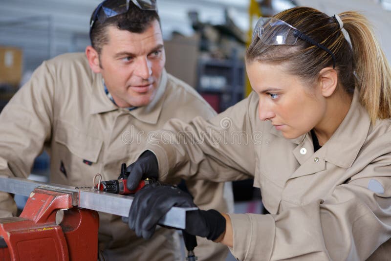 Industrial Female Apprentice Working with Supervisor Stock Photo ...