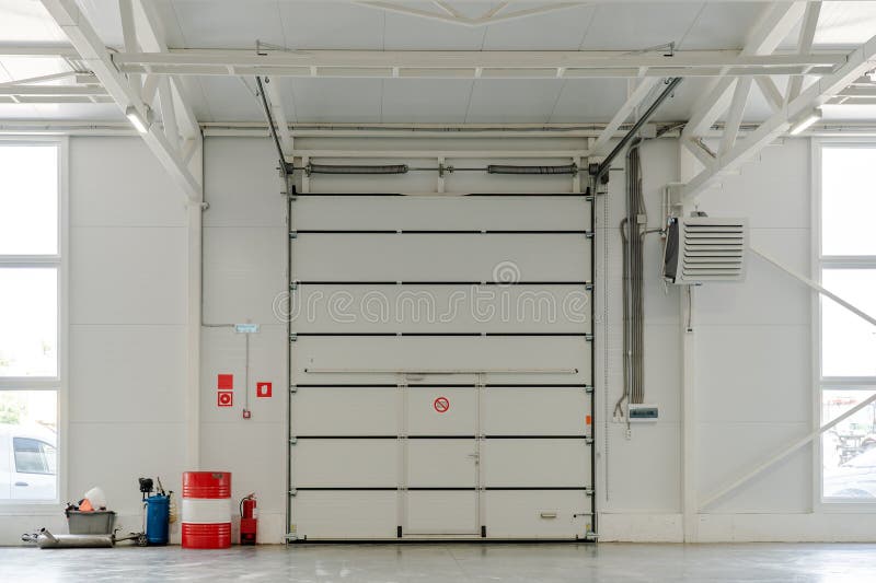 Industrial Garage Door in Modern Warehouse Interior with Fire Safety ...