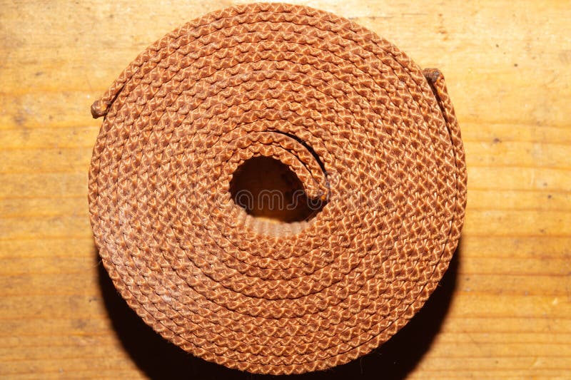Industrial Harness Rolled Up on a Wooden Table. Working Tool Stock ...