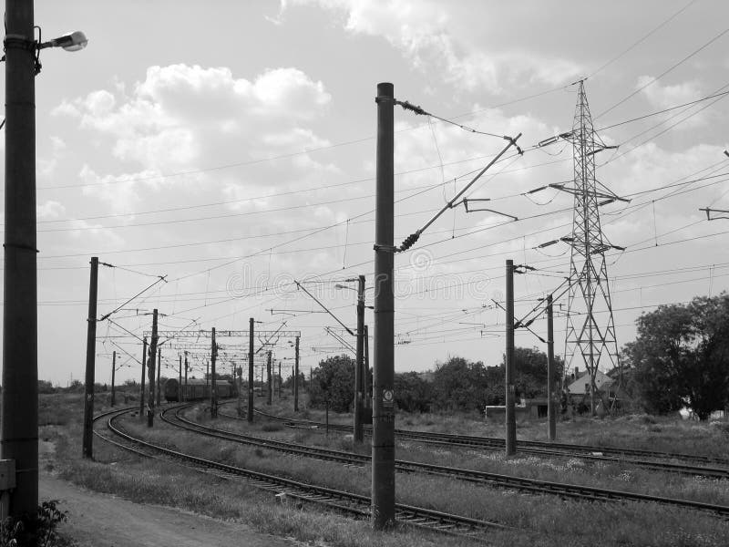 Industrial High Voltage Power Lines And Train Tracks Picture. Image: 997263