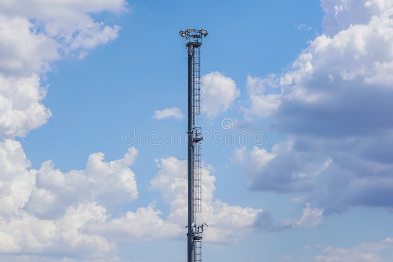 Spotlight Tower Against Blue Sky. Street Lamp. Modern Light Pole Stock ...
