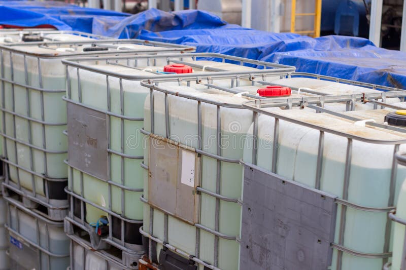 Industrial Liquid Containers in a Storage Area Showcasing Large Volumes ...