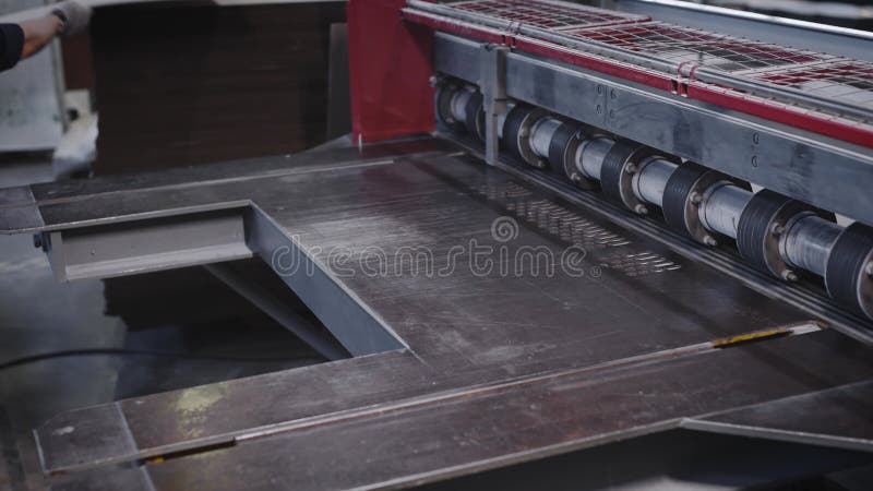 Industrial Machine for Cutting Sheets of Cardboard. Production of ...