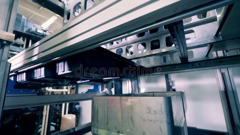 Industrial Machine is Displacing Plastic Containers Stock Video - Video ...