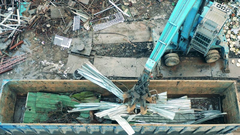 Industrial Machine is Loading Scrap Metal into a Container Stock ...