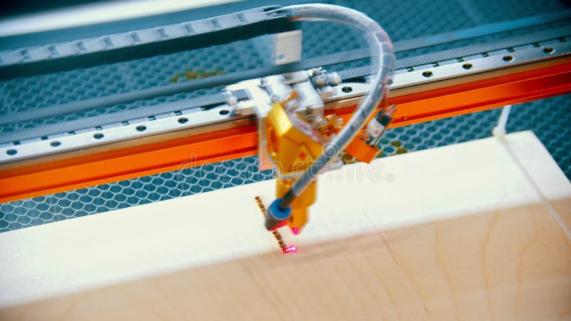 An Industrial Machine Making Marks on the Wooden Detail Using Laser ...