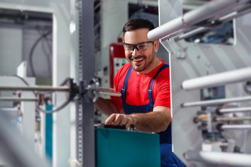 Industrial Machine Operator Working in Factory. Stock Photo - Image of ...