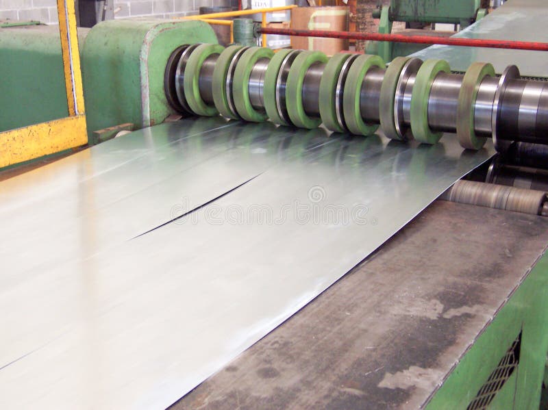 Steel Cutter Machine for Coils with Moving Worker. Industrial En Stock ...