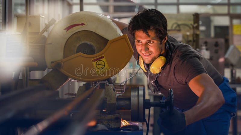 Industrial and Metal Factory Worker Fucusing in Operating Cutting ...