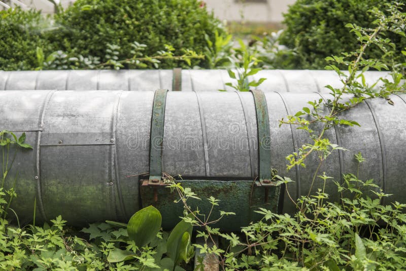 Industrial Metal Gas Pipe in a Green Grass. Stock Image - Image of ...