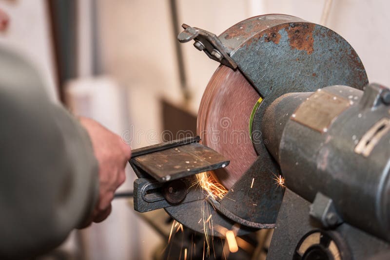 Industrial Metal Worker Use the Grinding Machine Stock Image - Image of ...