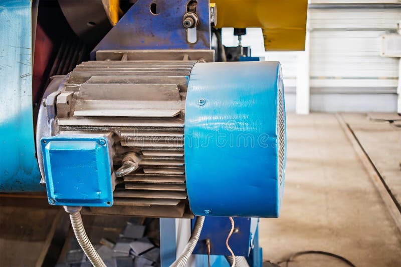 Close-up View of an Industrial Motor on a Machinery Floor Showcasing ...