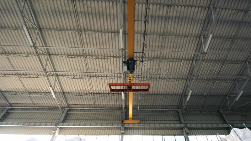 Industrial Overhead Crane in a Modern Warehouse. Large Yellow Overhead ...