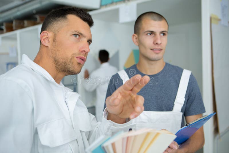 Industrial Painting Apprentice Talking To Teacher Stock Image - Image ...
