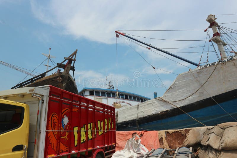 Loading Commodities from Truck into Cargo Ship Editorial Image - Image ...