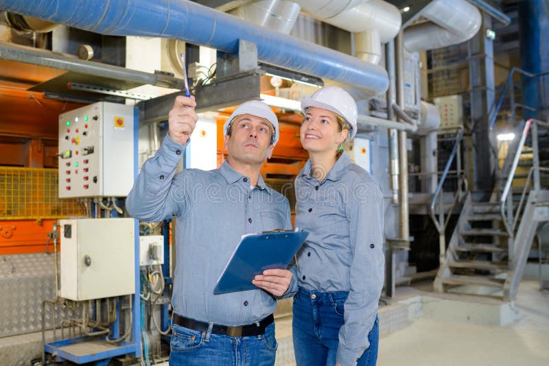 Industrial Pipe Maintenance Worker Showing Apprentice Stock Photo ...