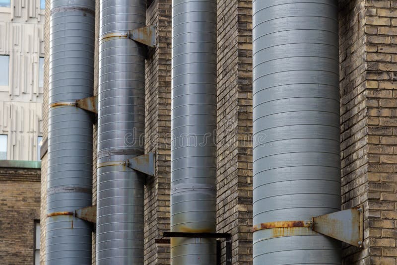 Industrial Pipes on a Building Stock Photo - Image of color, container ...