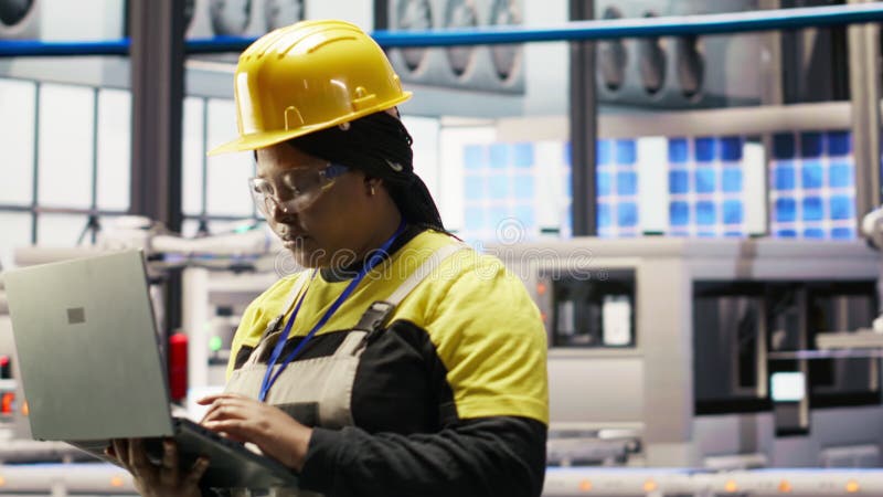 Industrial Plant Engineer Using Laptop To Implement Automated Workflows ...