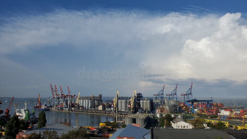 Industrial Port Landscape with Cargo Cranes and Grain Elevators Under ...