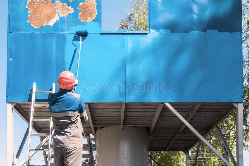 Industrial Professional Painter Paints Metal Surface with Roller on ...