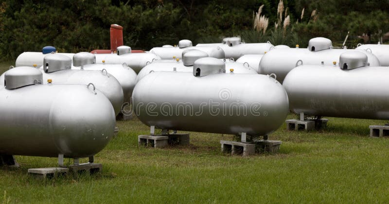 Propane tanks in a field stock image. Image of fuel - 192970705