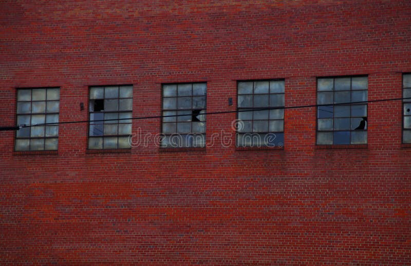 Industrial Red Brick Facade with Broken Windows Stock Image - Image of ...
