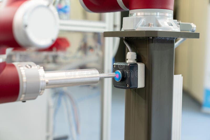 Industrial Robot Presses the Button. Accuracy Calibration Stock Photo ...