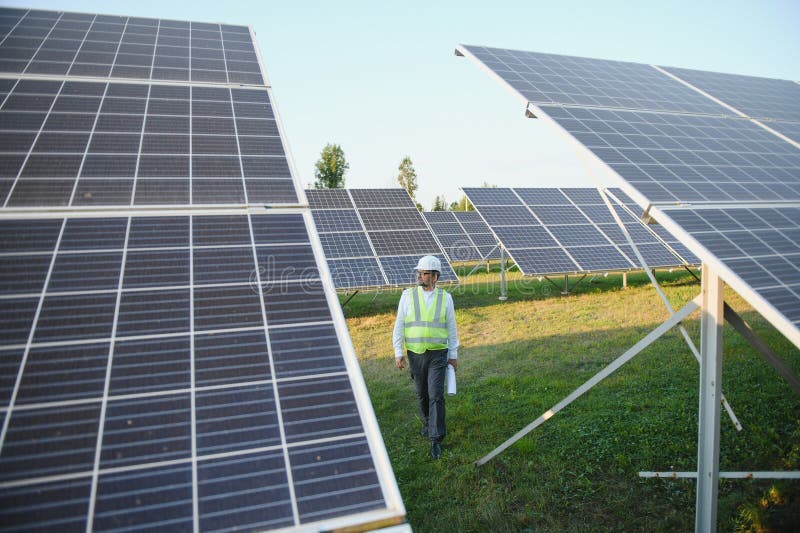 Industrial Senior Man Engineer Walking through Solar Panel Field for ...