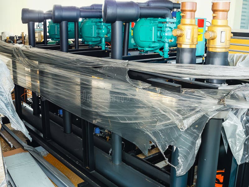 Industrial Equipment Setup with Pipes and Machinery, Covered in ...