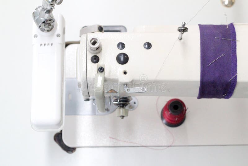 Industrial Sewing Machine, Top View. There is a Lamp on the Side. There ...