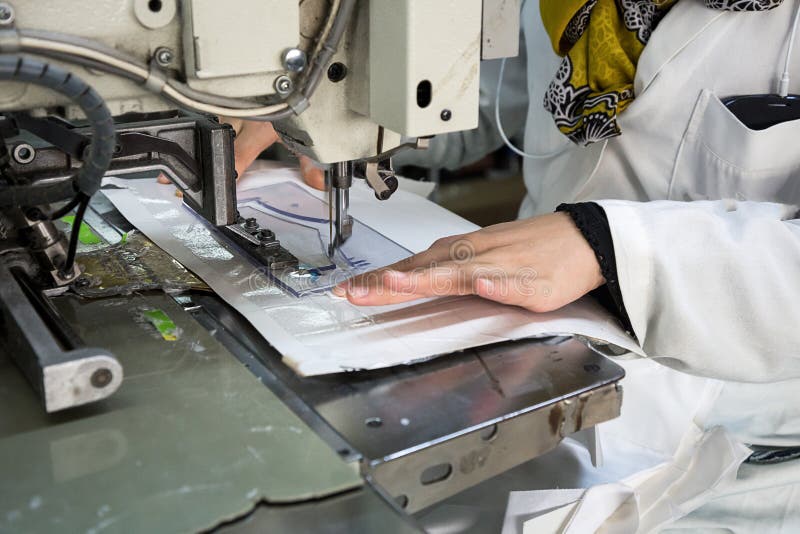 Industrial Sewing Machines with Sewing Machine Operator Stock Photo ...