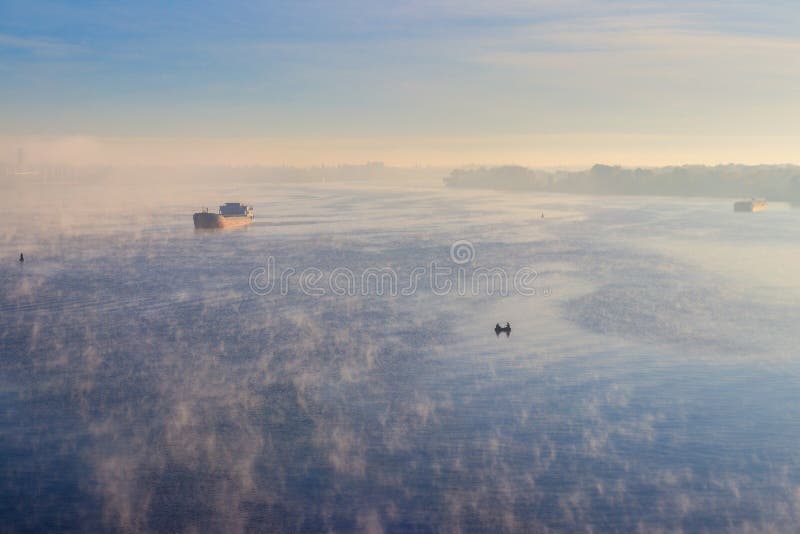 Industrial Ship Sailing Down River in the Mist at Morning Stock Image ...