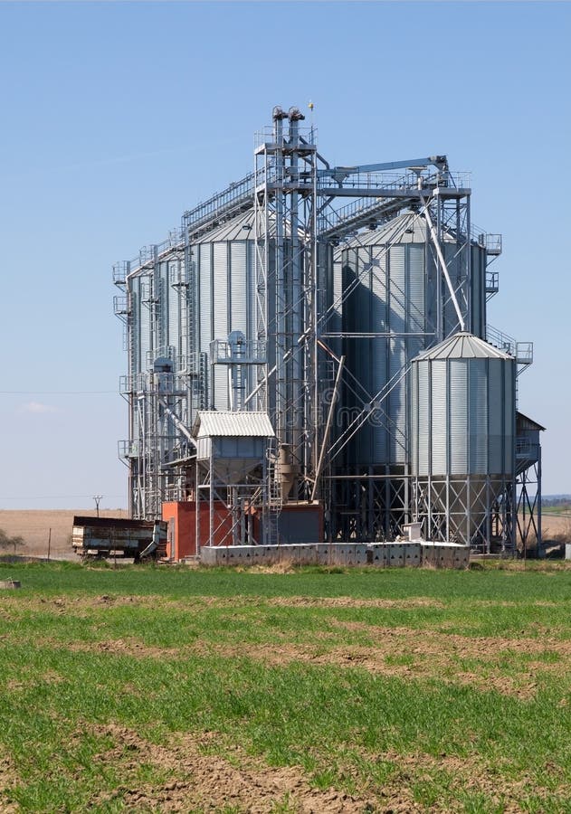 Industrial Silos Under Blue Sky, in the Field Stock Image - Image of ...