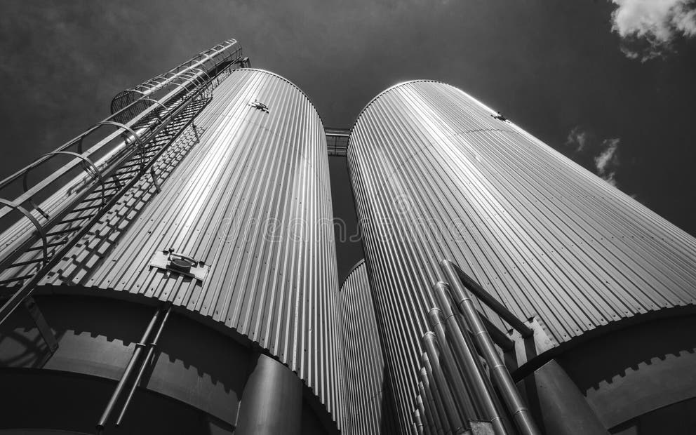 Industrial Silos Under Cloudy Sky. Stock Photo - Image of design ...