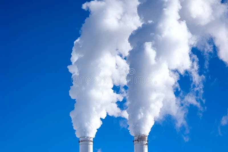 Industrial Smokestacks Releasing Thick White Smoke into Blue Sky Stock ...