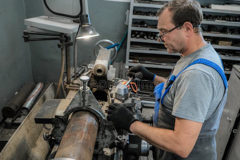 Industrial Technician Working with Lathe Machine Setup. Stock Photo ...