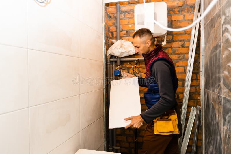 Industrial Tiler Builder Worker Installing Floor Tile at Repair ...