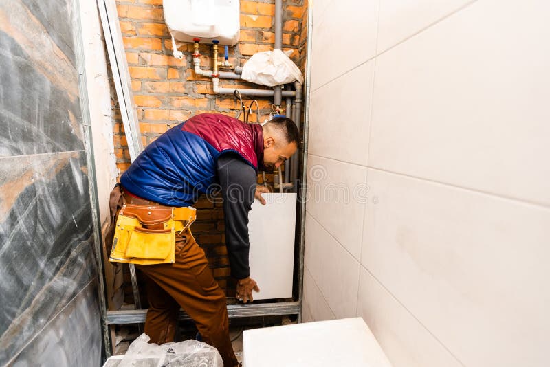 Industrial Tiler Builder Worker Installing Floor Tile at Repair ...