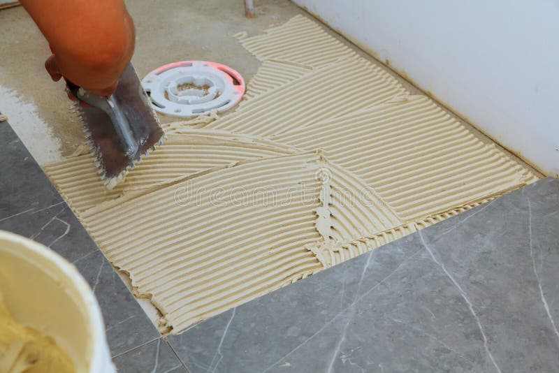 Industrial Tiler Builder Worker Installing Floor Tile Stock Photo ...