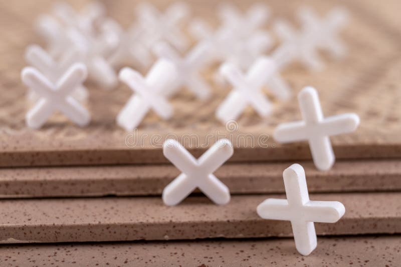 Plastic Crosses that Position the Tiles when Laying. the Process of ...