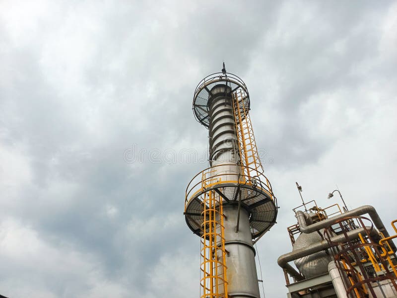 Industrial Tower with Cloudy Sky Provides Striking Image of Modern ...