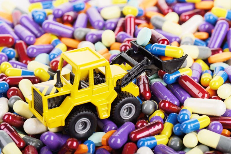 Industrial Tractor Toy Load Pills and Tablets Stock Photo - Image of ...