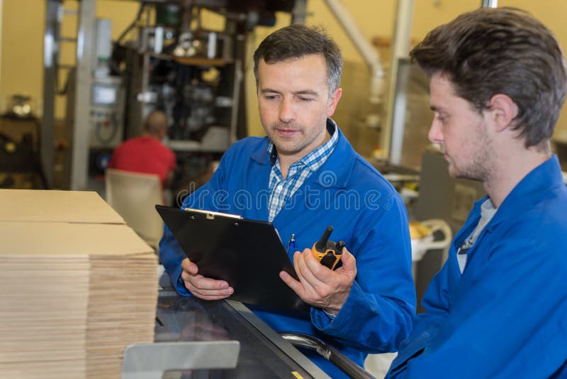 Industrial Trainer at Work with Trainee Stock Image - Image of ...