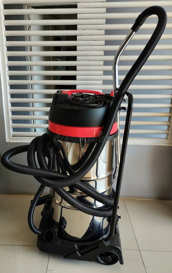 The Industrial Vacuum Cleaner in Work. the Hard Cleaning Indoor. Stock ...