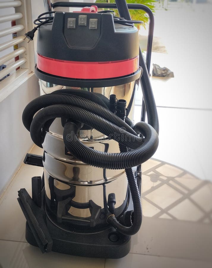 The Industrial Vacuum Cleaner in Work. the Hard Cleaning Indoor. Stock ...